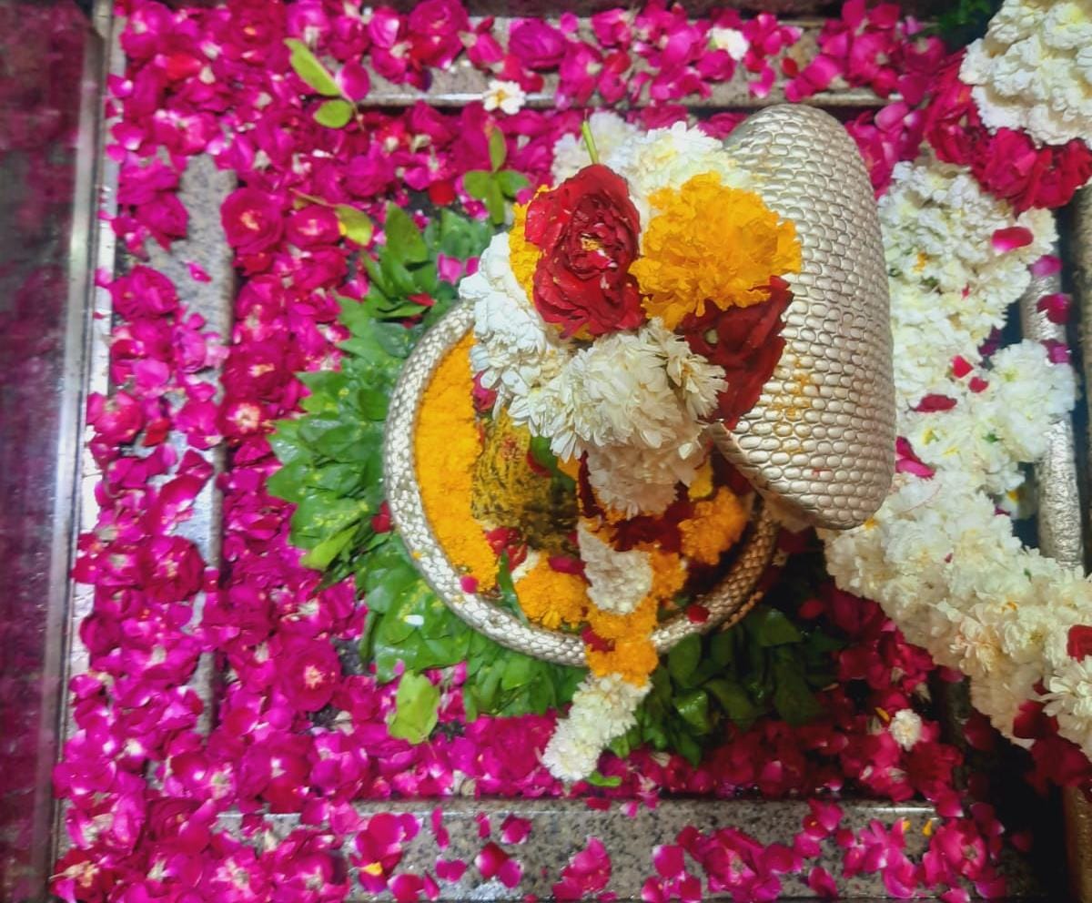 Lord Omkar and the court decorated with flowers in Mangala Aarti, see ...