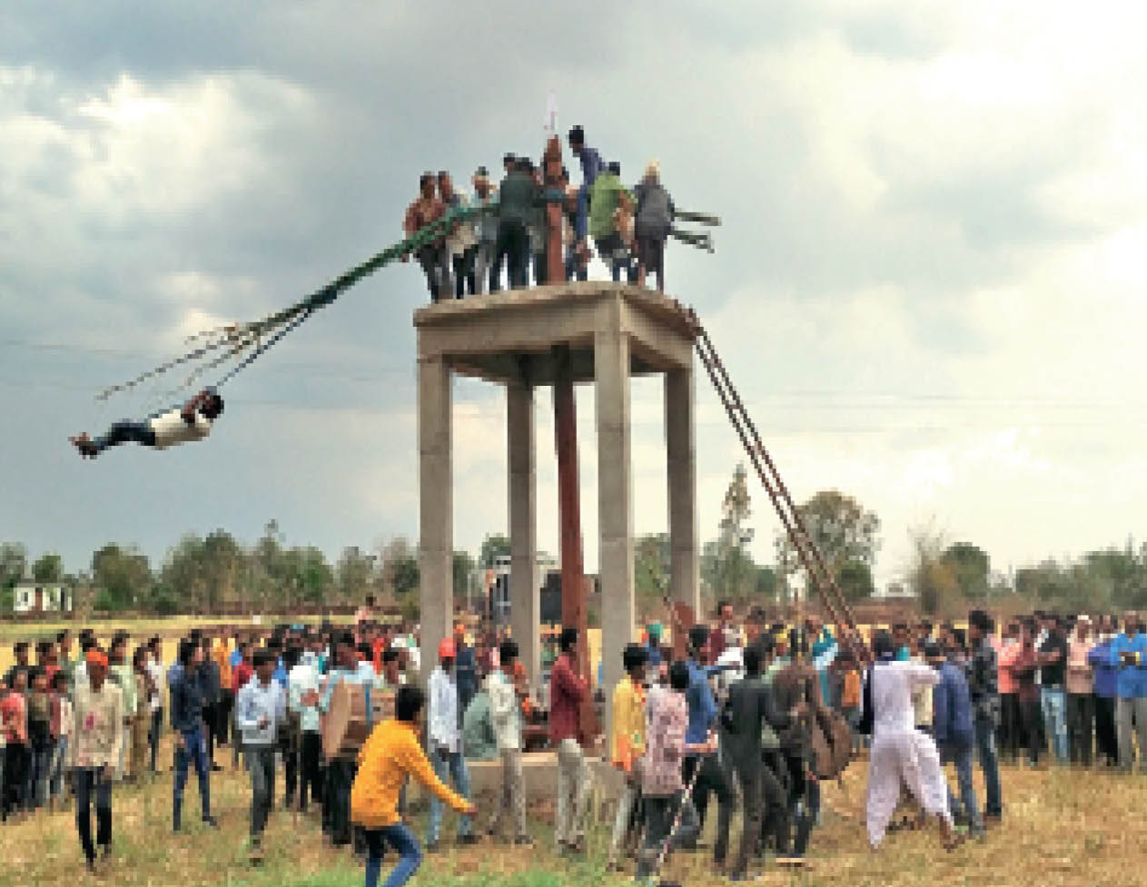 People swing in the air around the 30 feet high scaffolding when the ...