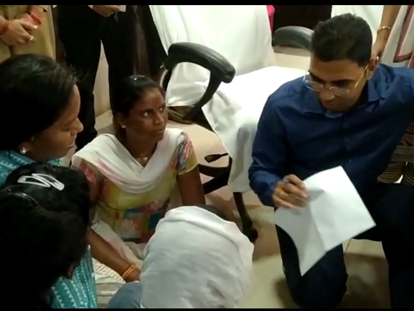 Collector sitting on the ground after getting down from the chair ...