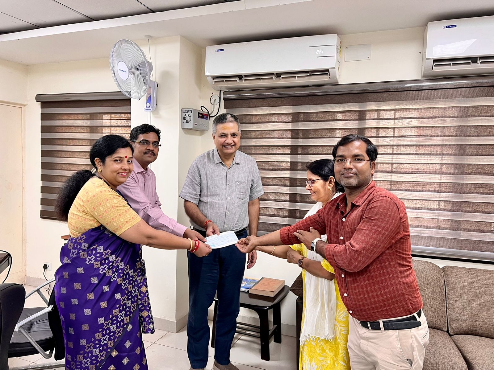 Self. Dr. Shashi Bala, wife of Professor Anand Shankar Singh, handed ...