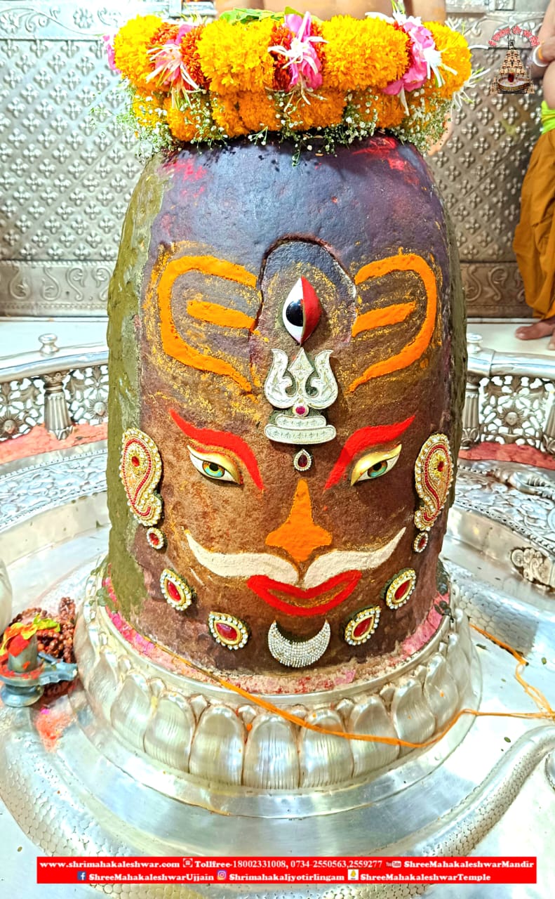 By offering Trishul Trinetra and Om on the head of Lord Mahakal and ...