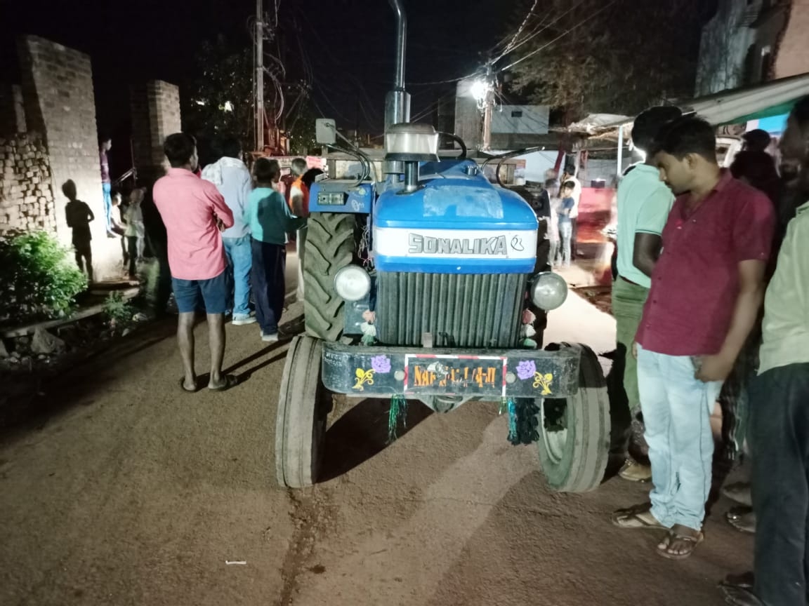 The tractor wheel stopped before the woman came over, the couple was ...