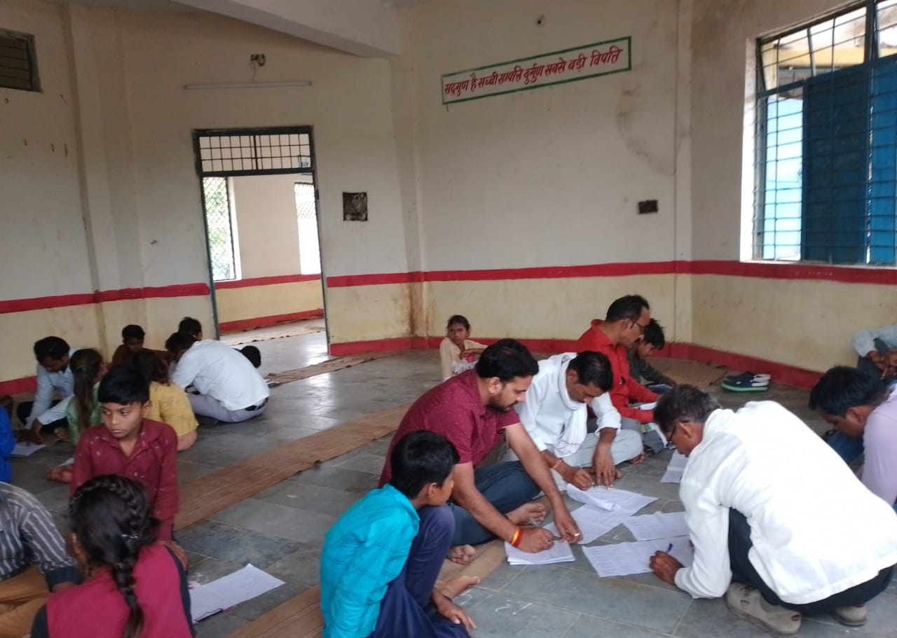 Teacher was writing the answer sheet in the supplementary examination ...