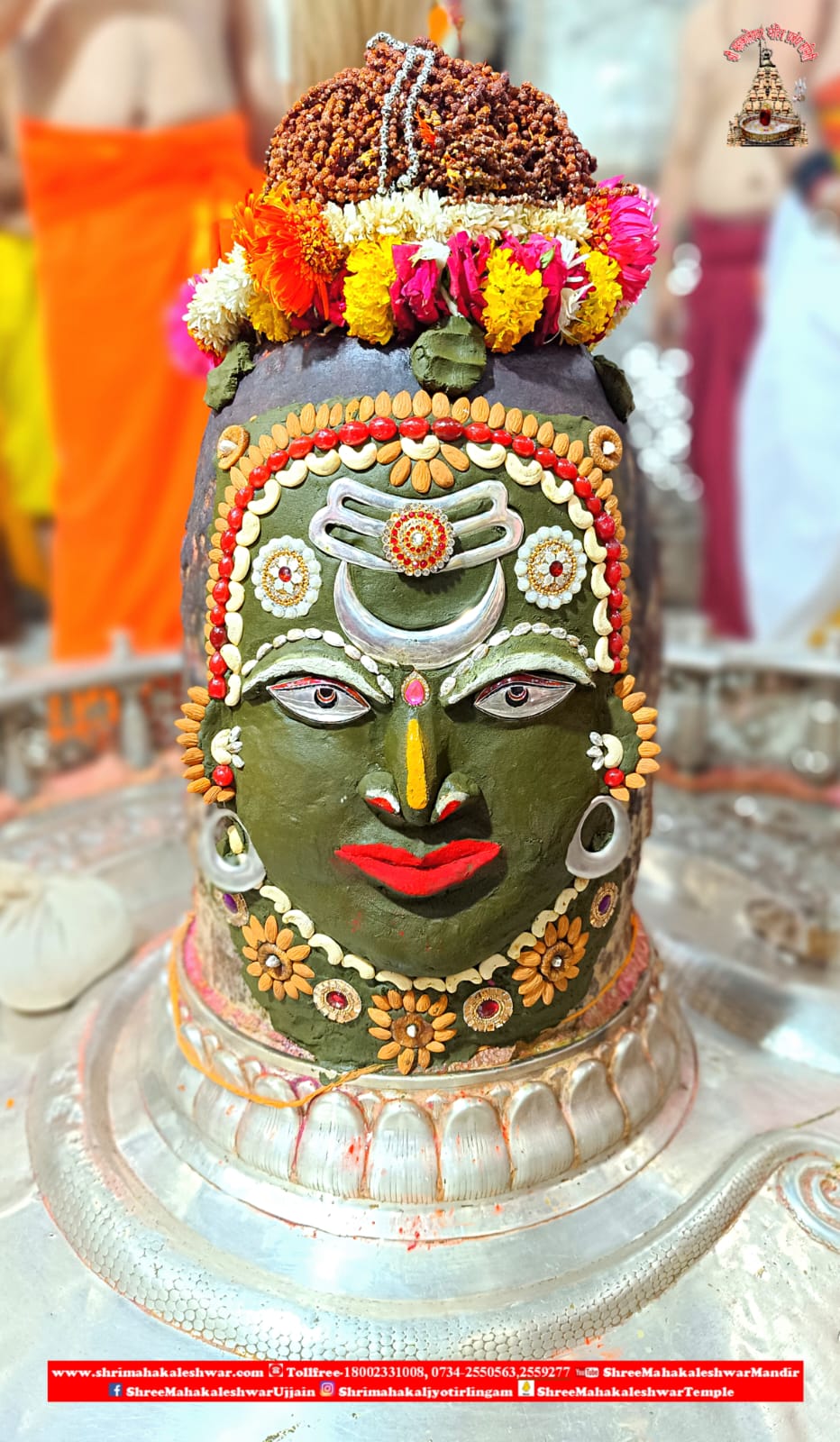 Shringar in the form of a king by offering fragrant flowers with silver ...
