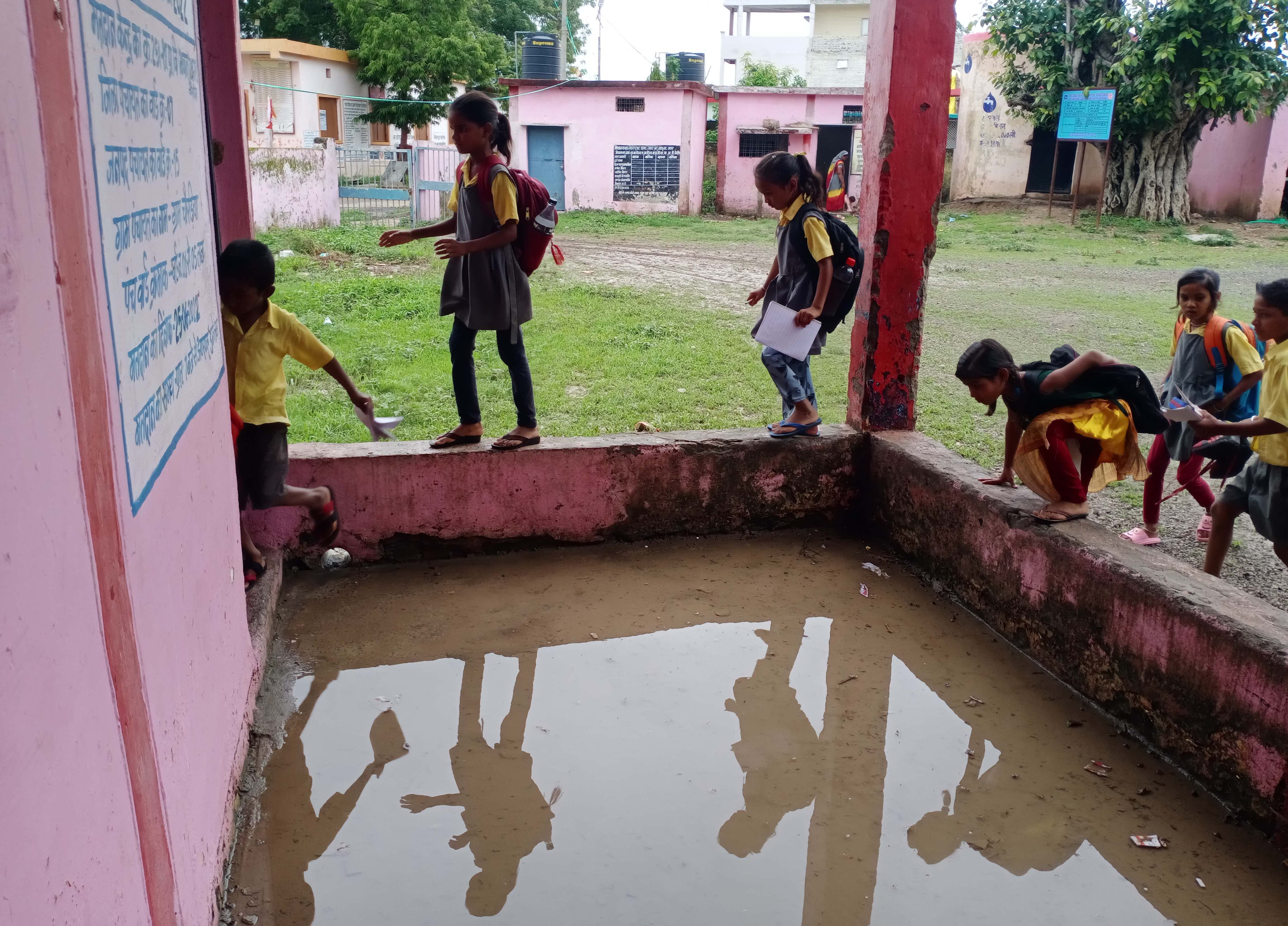 Children reached inside by taking risk with the help of water filled in ...