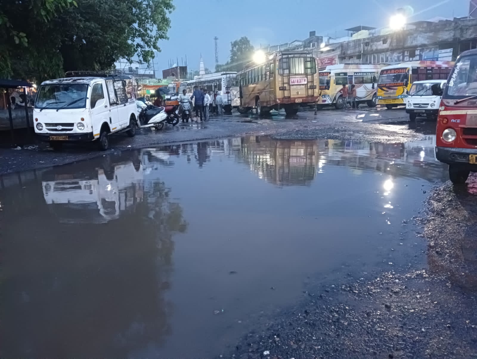 Rain water filled the bus stand premises, dirt spread in the passenger ...