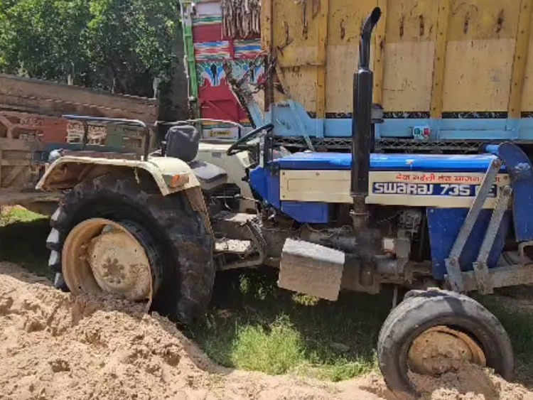 Tractor tire punctured by laying forks, ran away spreading gravel ...