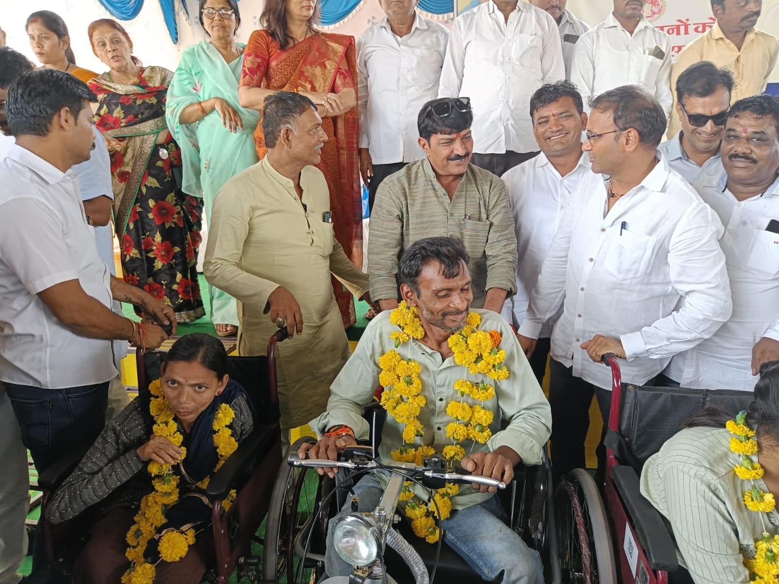 Faces of disabled people lit up after getting battery operated tricycle ...
