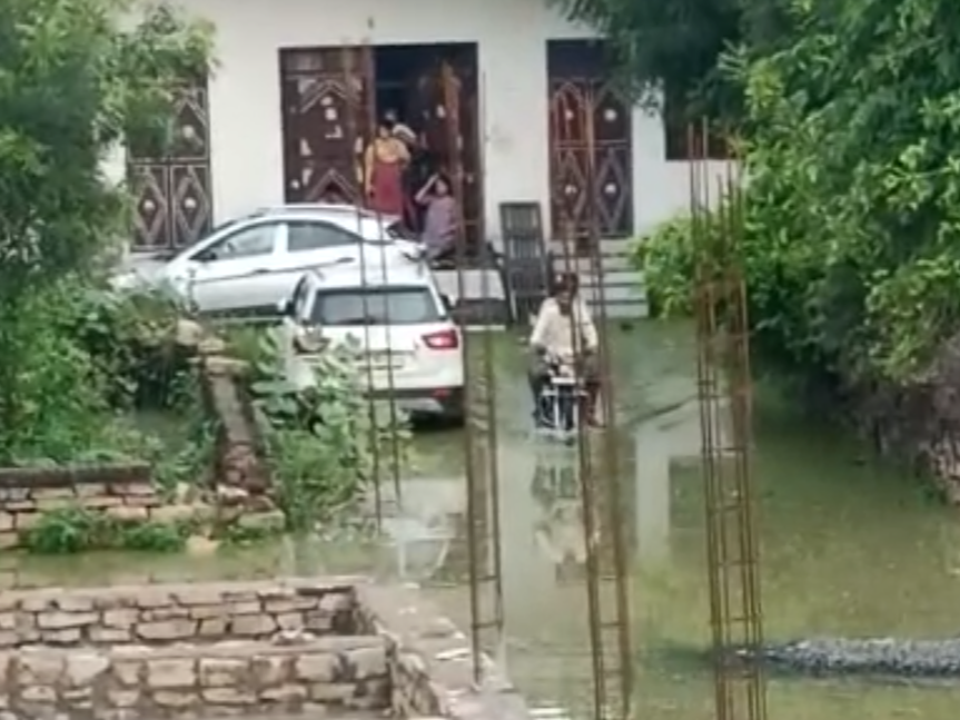Rain water filled in front of houses, forced to remain confined in ...