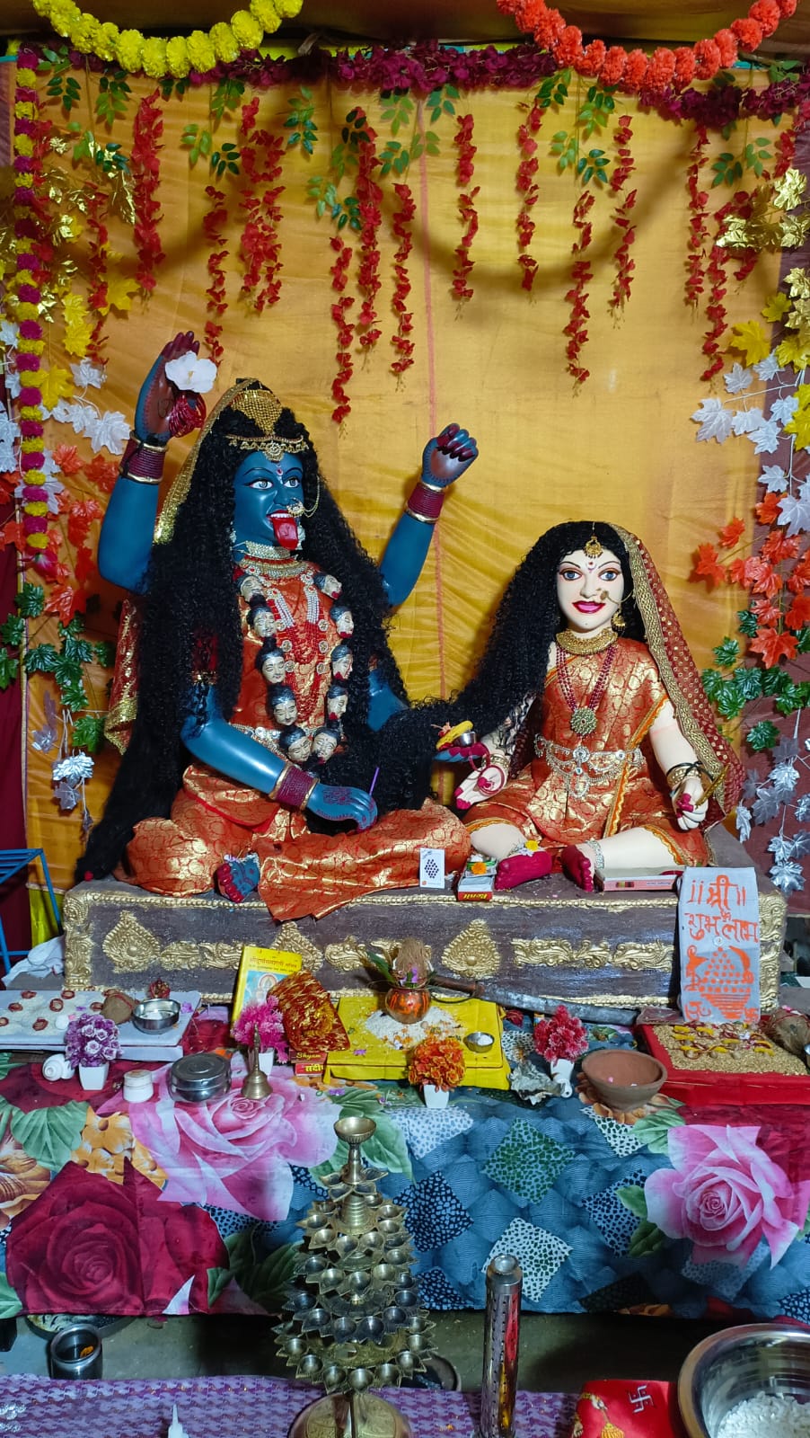 Mother's child form statue, Mahakali is making the hair of Mother Durga ...