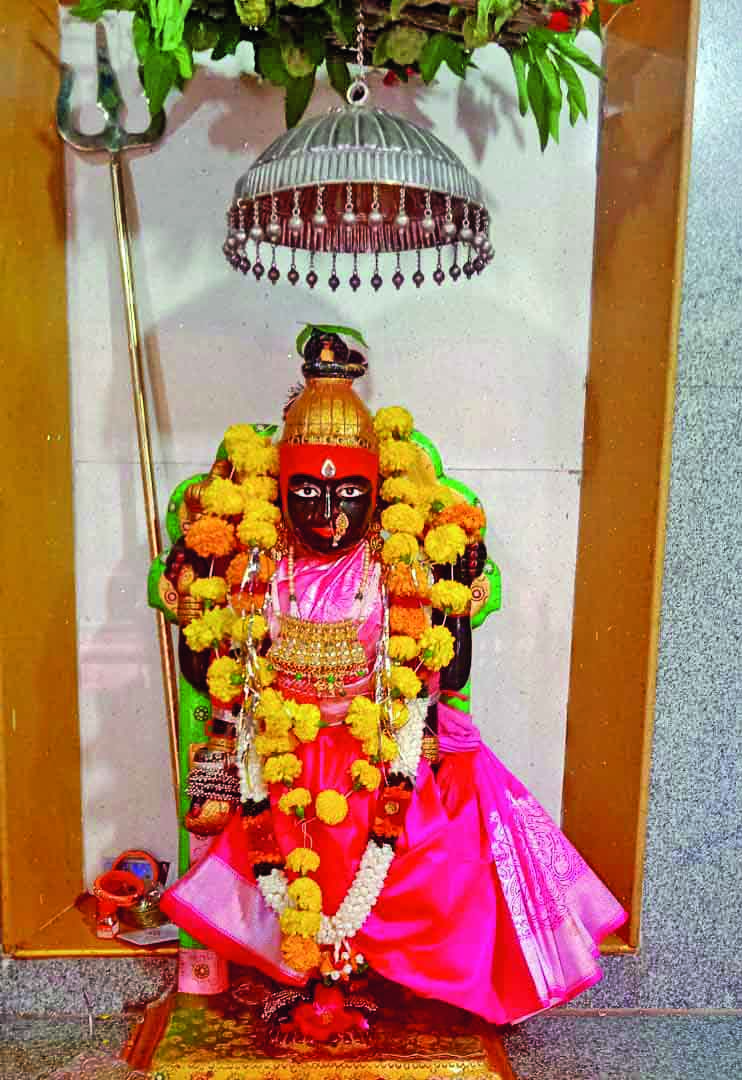 Dark complexioned, four-armed statue, with conch, chakra, mace, padma ...