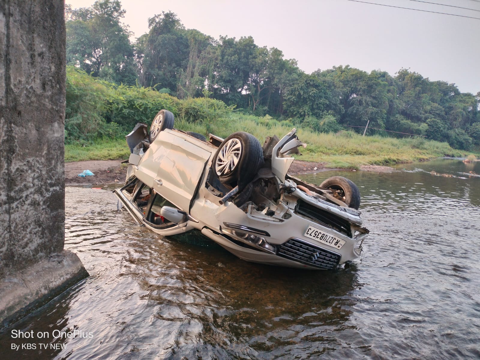 Due to the collision with the vehicle, the car broke the railing of the ...