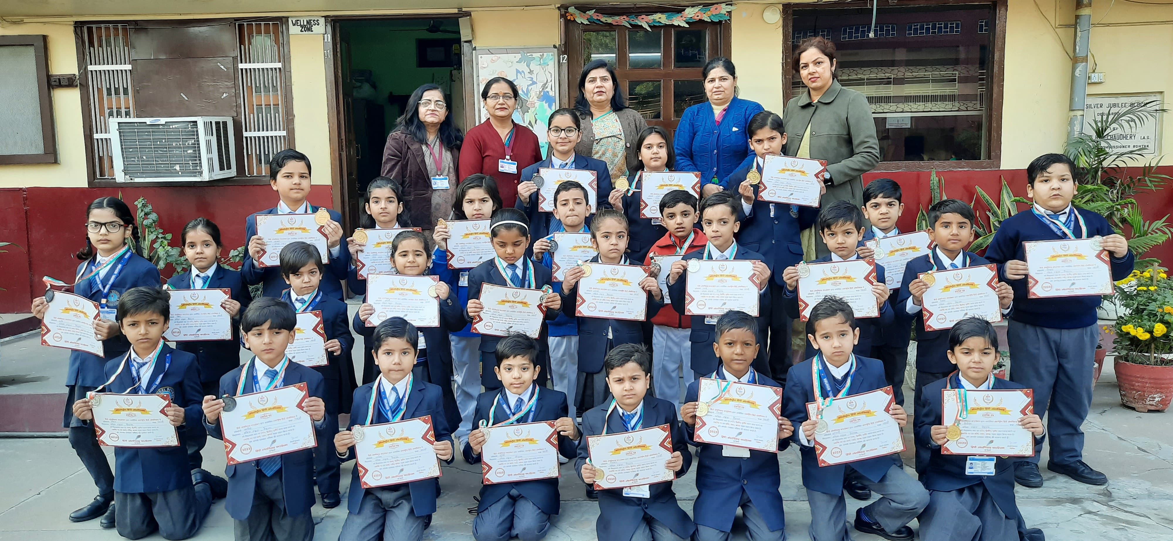 Model school students dominate in International Hindi Olympiad ...