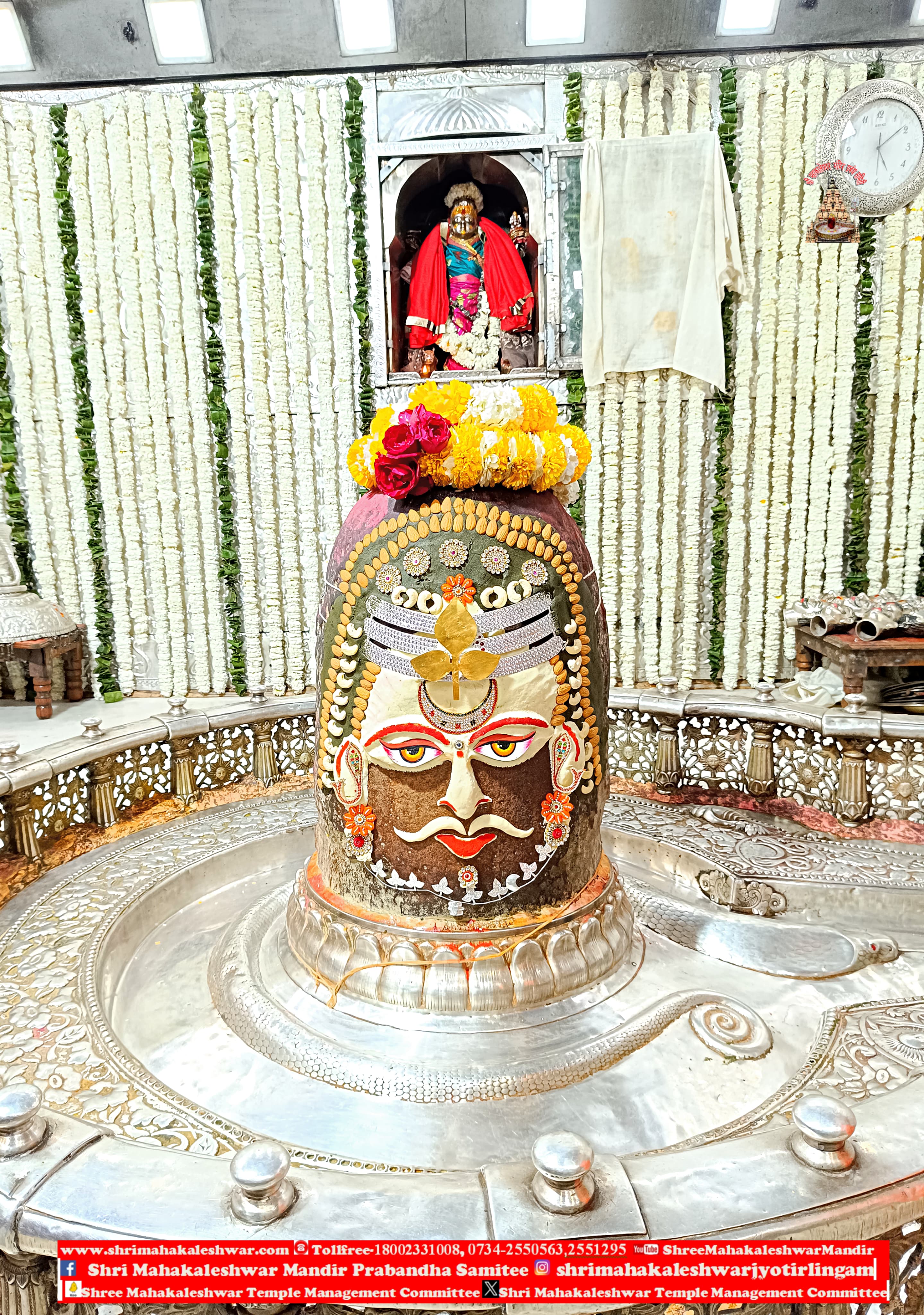 Shringar of Baba Mahakal by offering ornaments with tripund tilak and ...