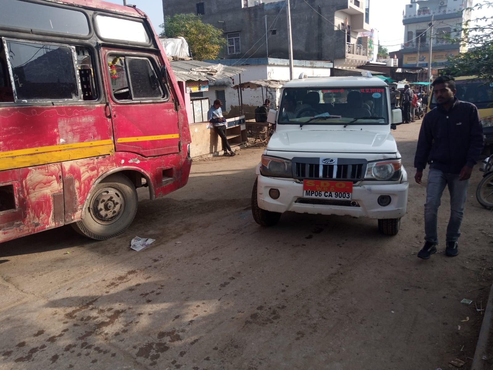 Stand not constructed, people have to wait for buses on the roadside ...