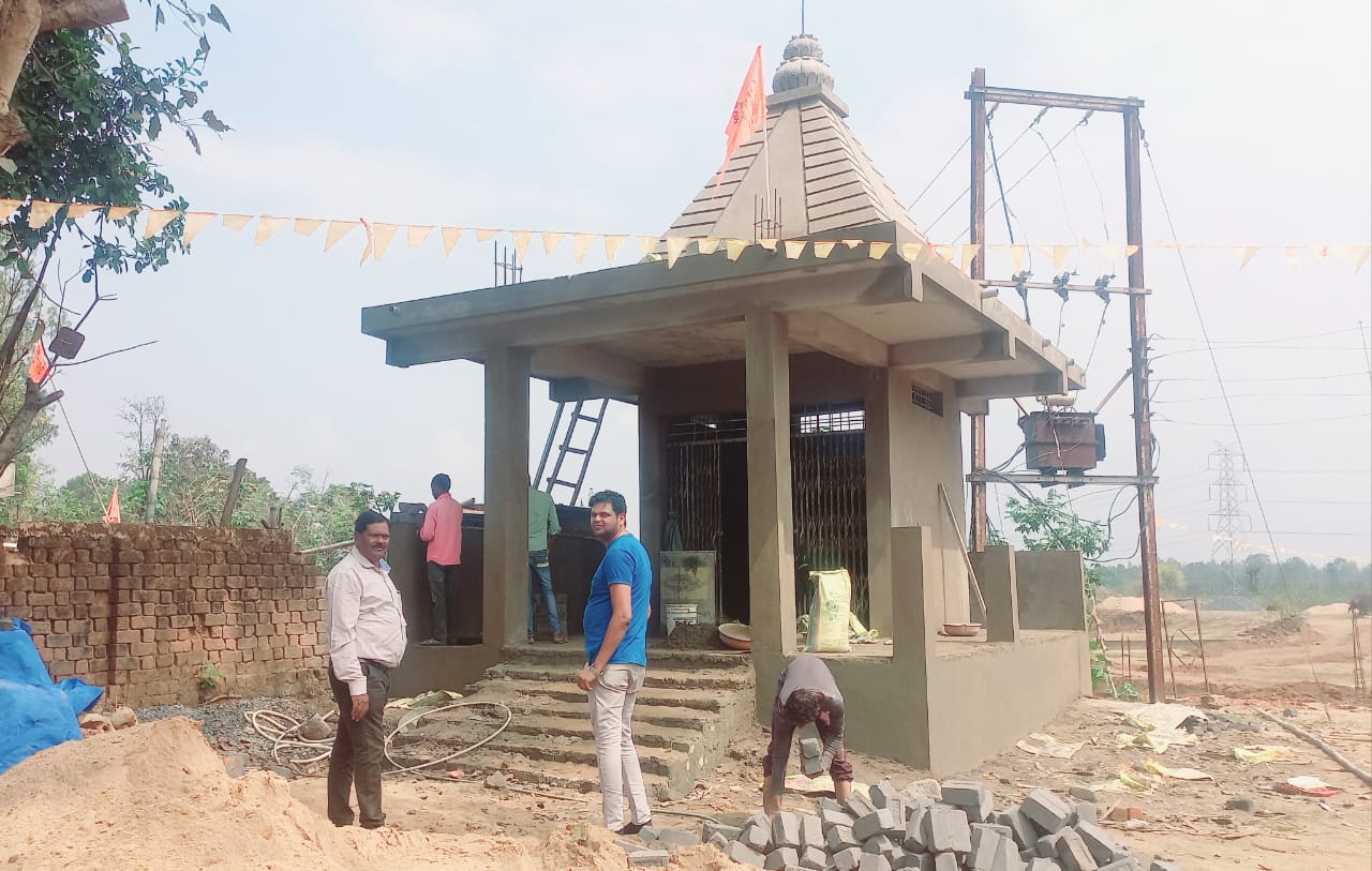 A new Shiva temple is being constructed on the bank of the pond with ...