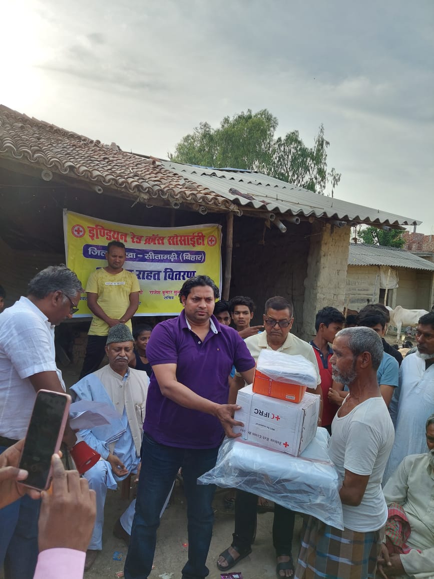 The Red Cross team distributed relief material among the fire victims ...