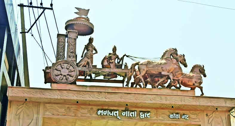 A statue of Lord Shri Krishna giving the message of Gita and Arjun's ...