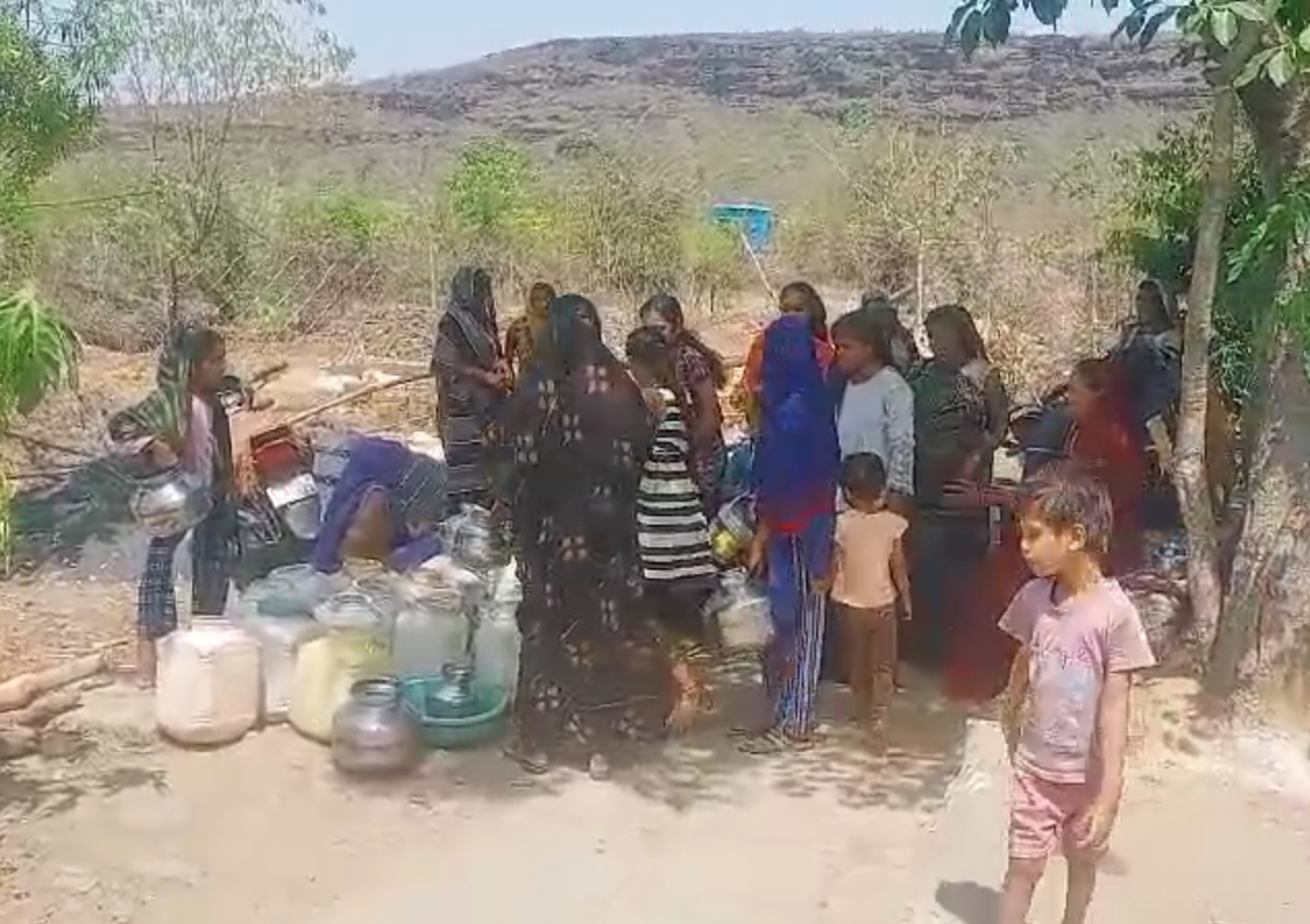 Women are filling water by descending into a 30 feet deep well