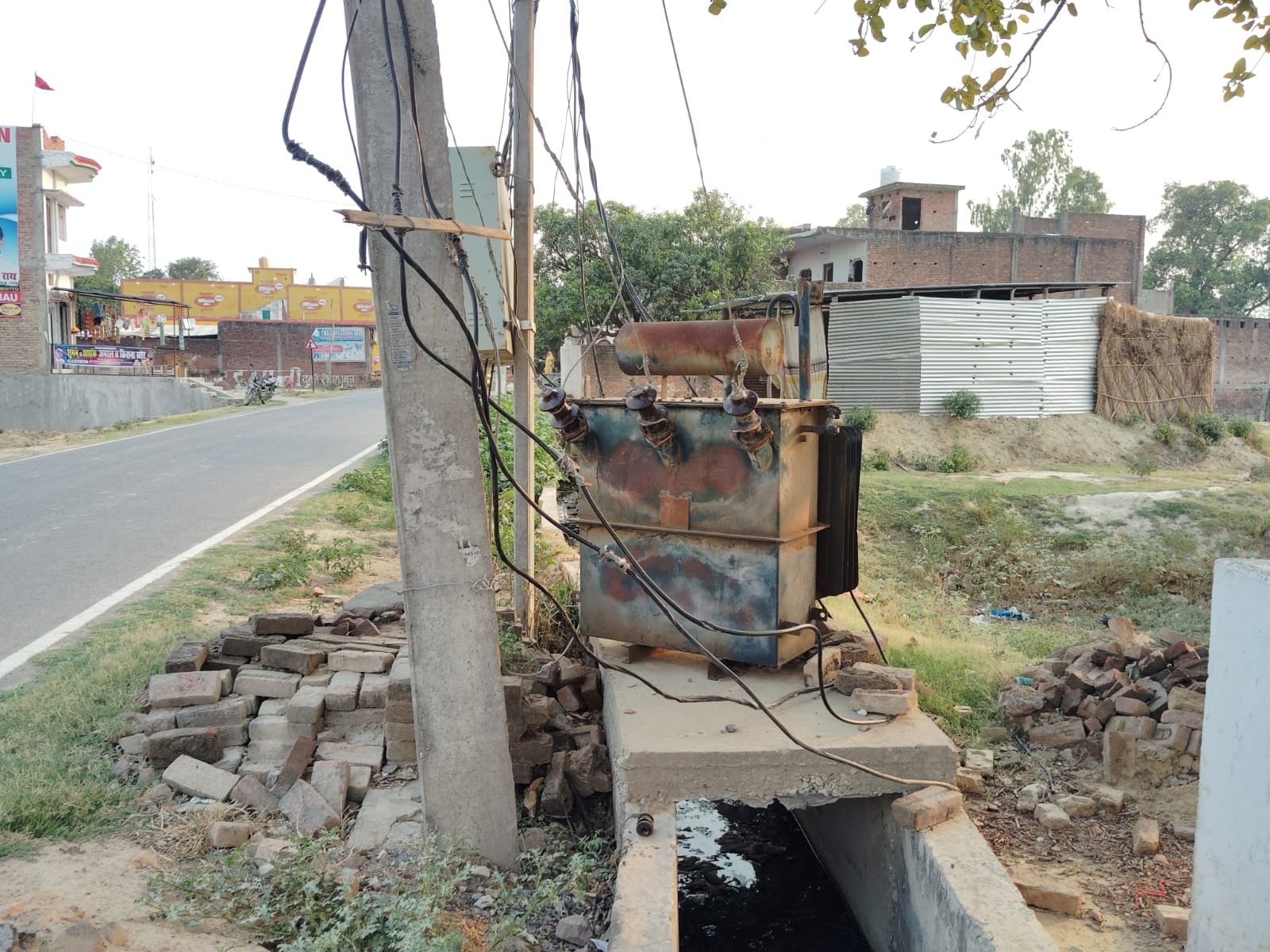 Electricity supply is being done by placing a transformer on the drain ...