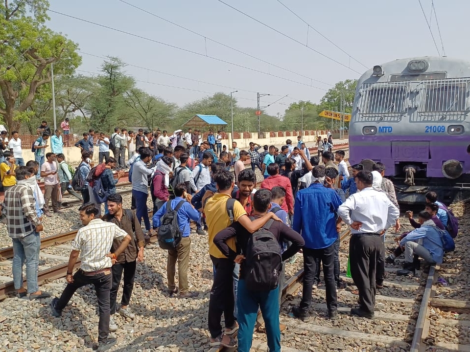 People sitting on the railway tracks at Chaumu-Samod railway station ...