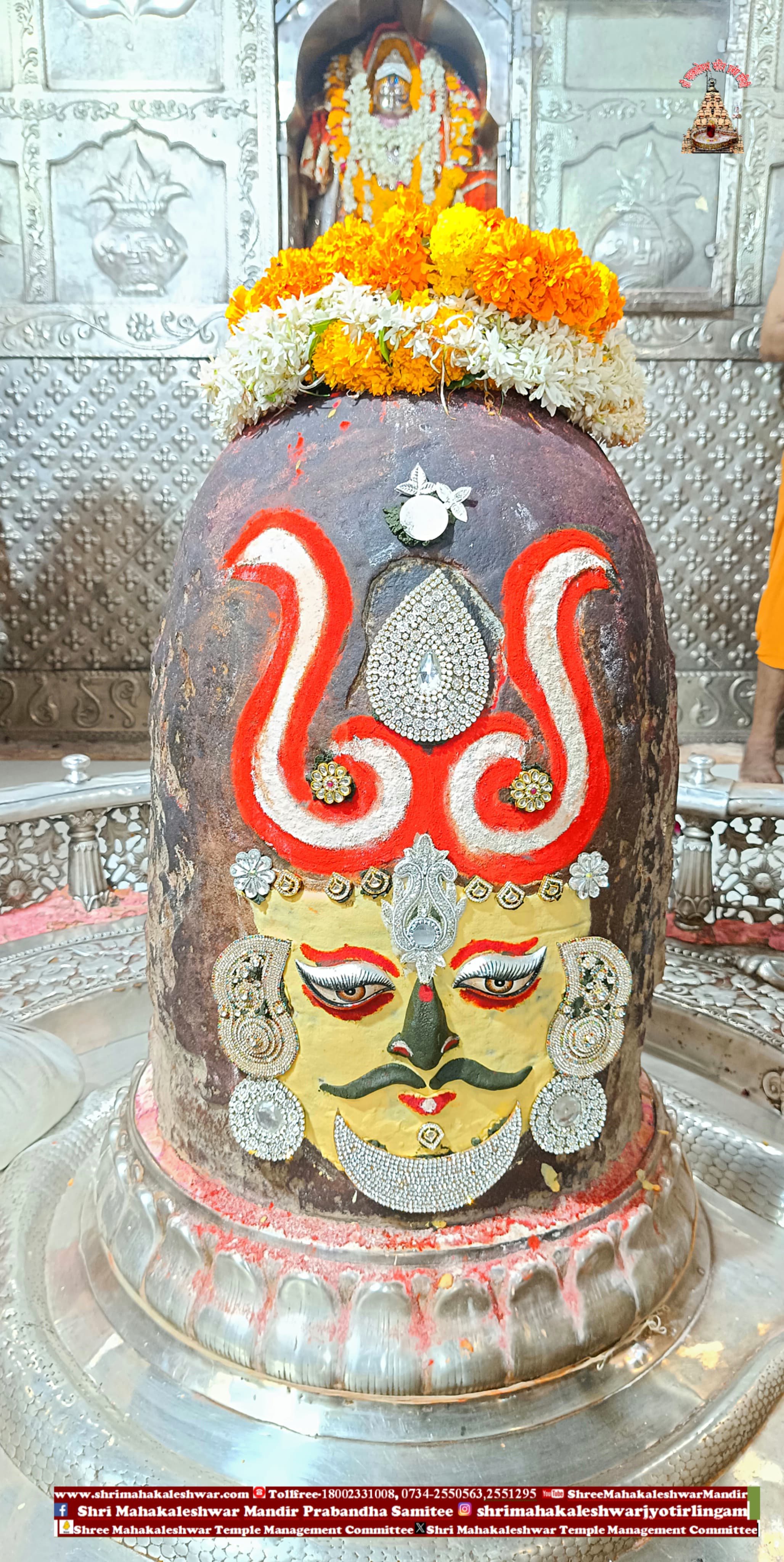Baba Mahakal is adorned in the form of a king by offering a garland of ...