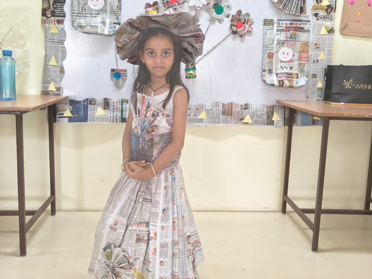 A ramp walk of clothes made from paper and newspaper was organised ...