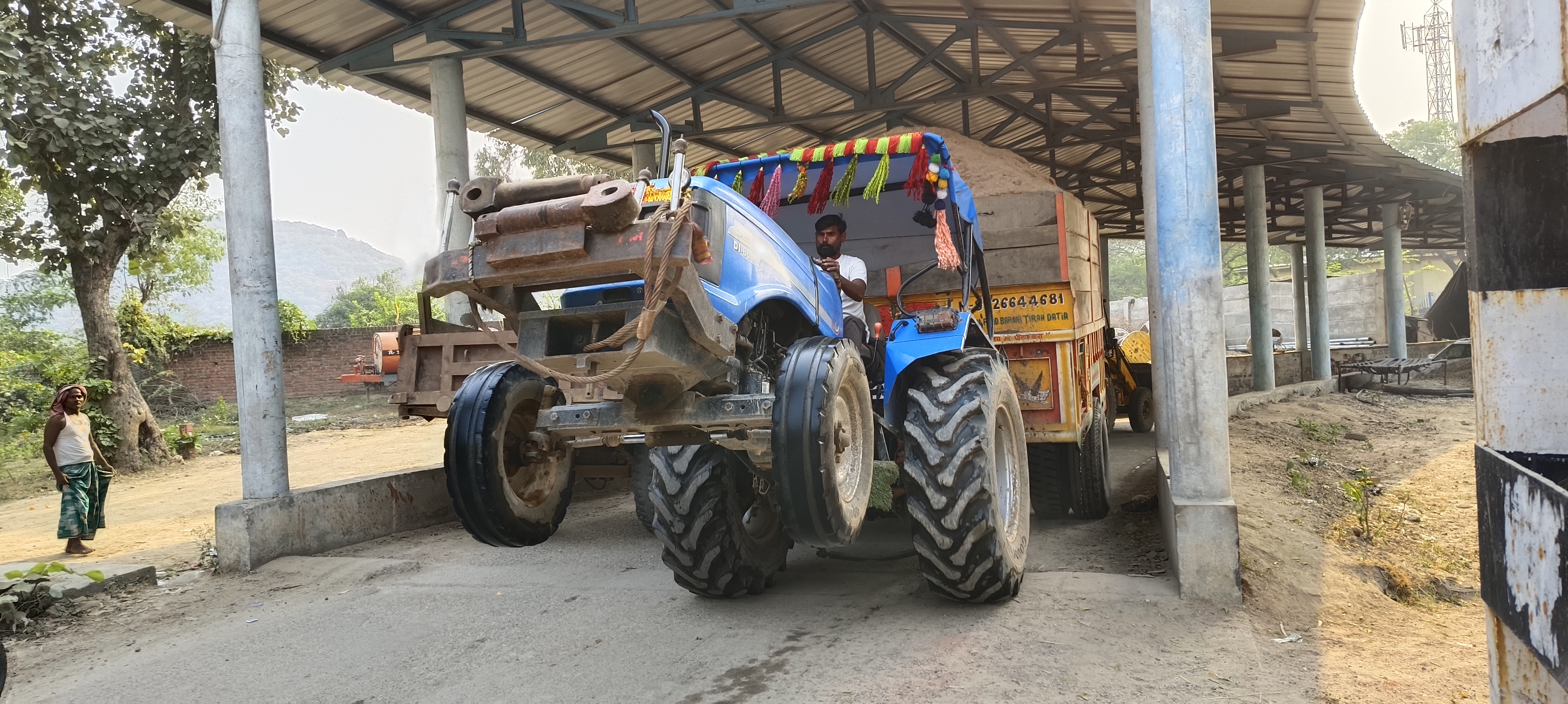 Tractor on two wheels overloaded with sand | ओवरलोड रेत से दो पहियों पर ...