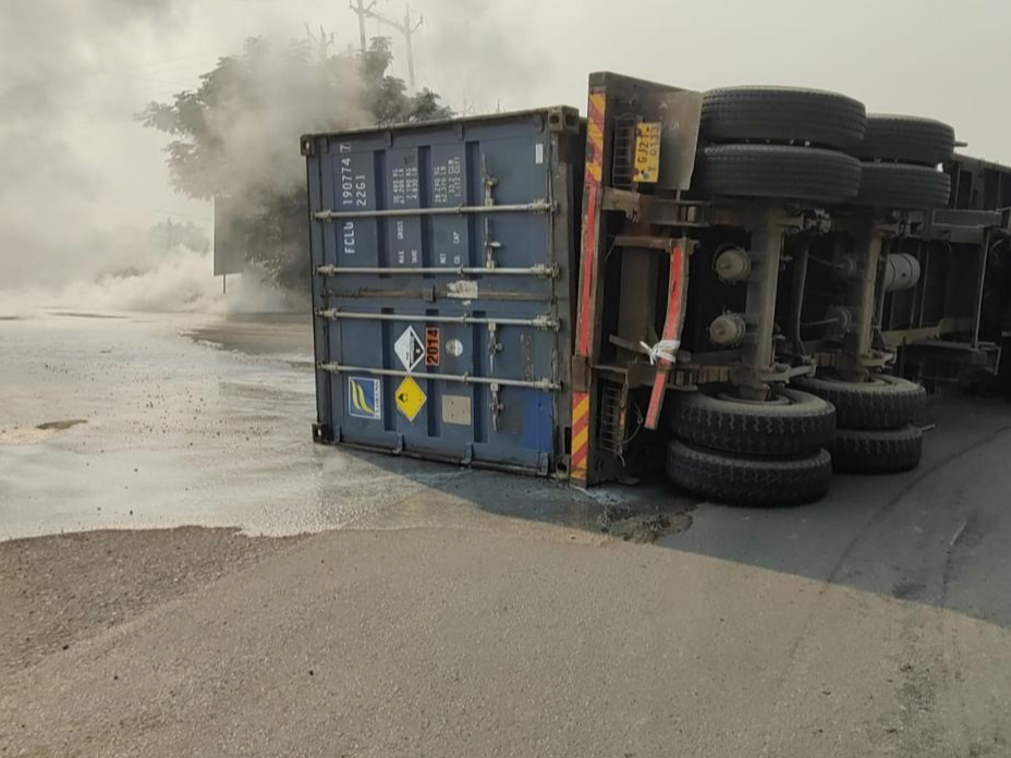 Container full of hydrogen peroxide filled cylinders overturned in ...