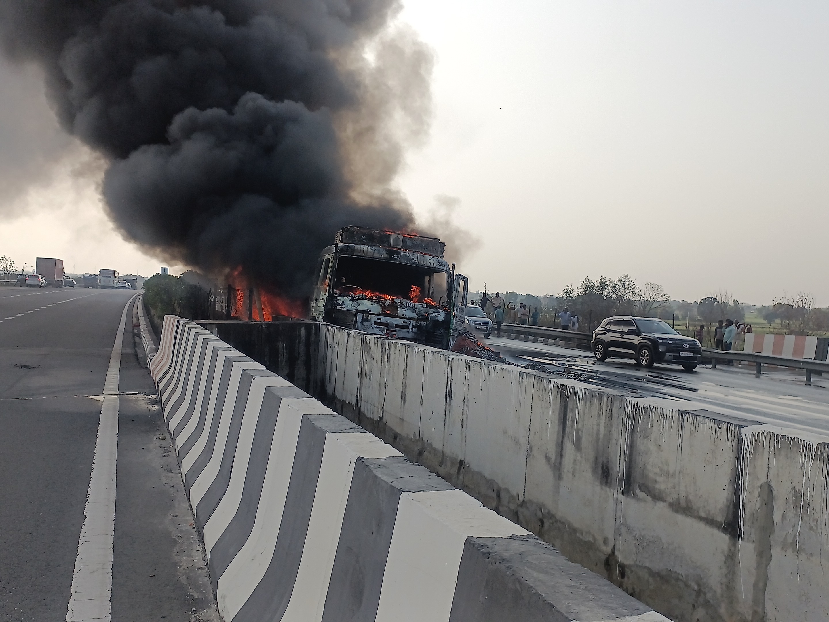 The truck collided with the divider after a tyre burst on the expressway
