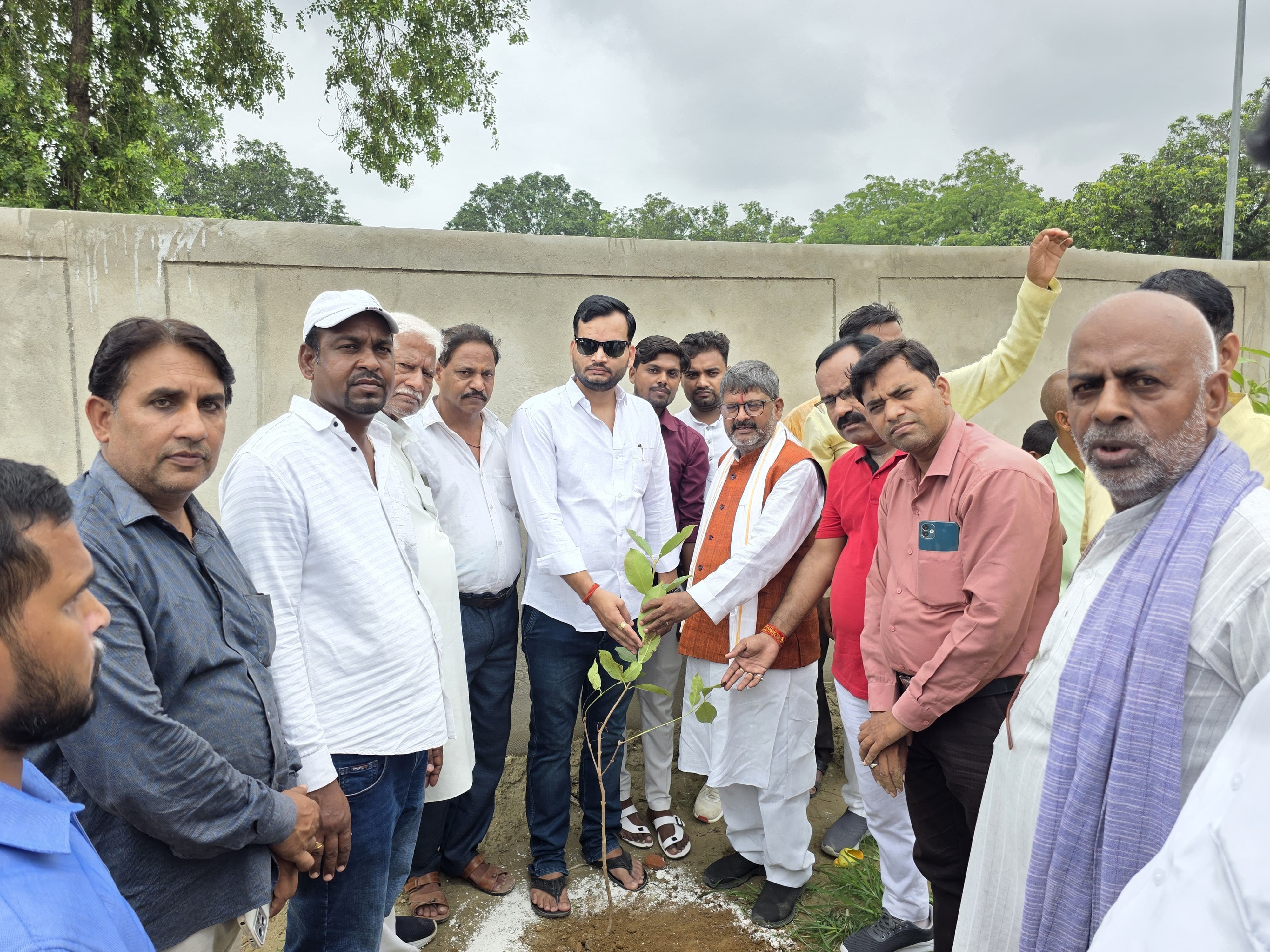 The MLA planted a sapling during Mann ki Baat