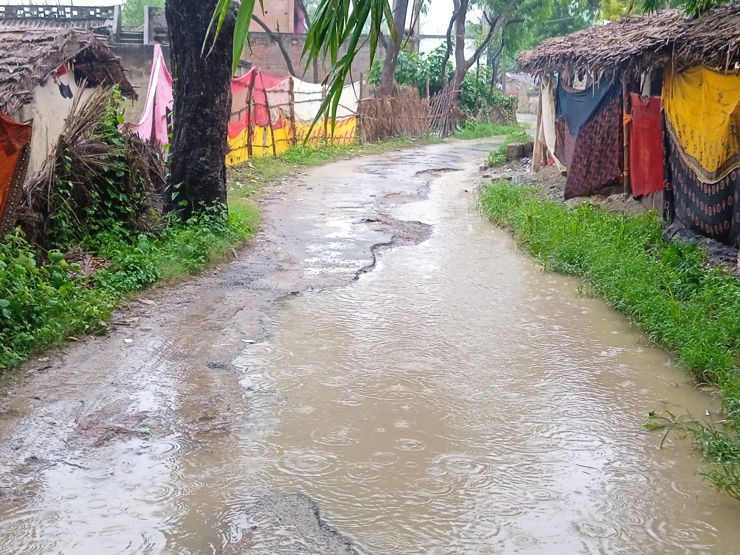 Drain water on the road in Imli village settlement
