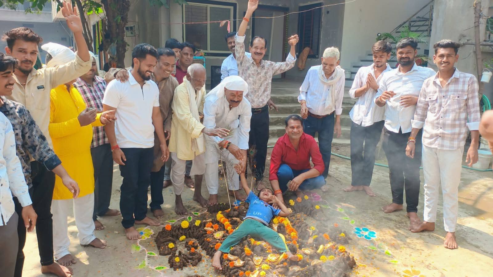 A figure of Lord Govardhan was made from cow dung and children were ...