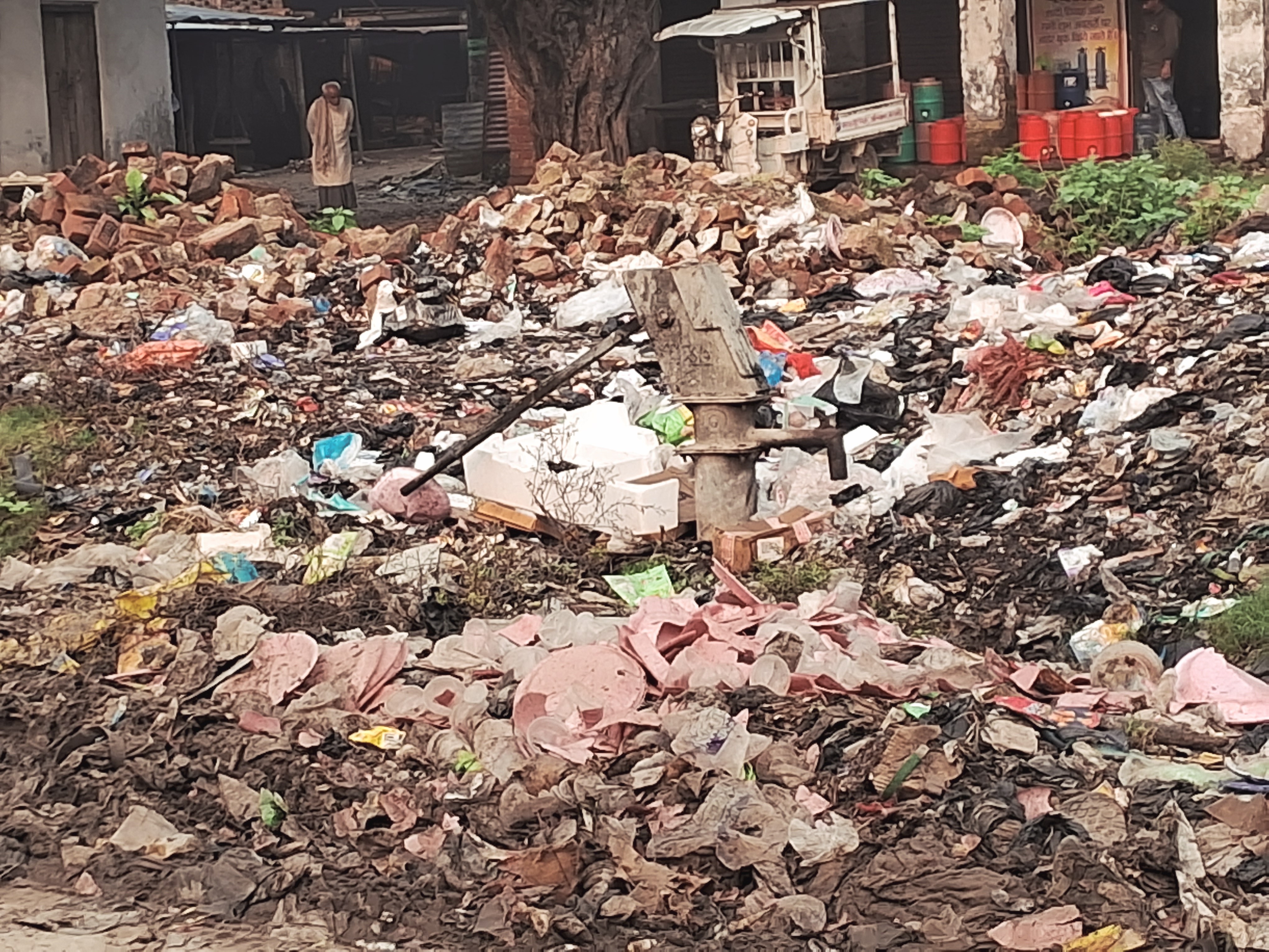 Hand pump buried under garbage in Dariyabad