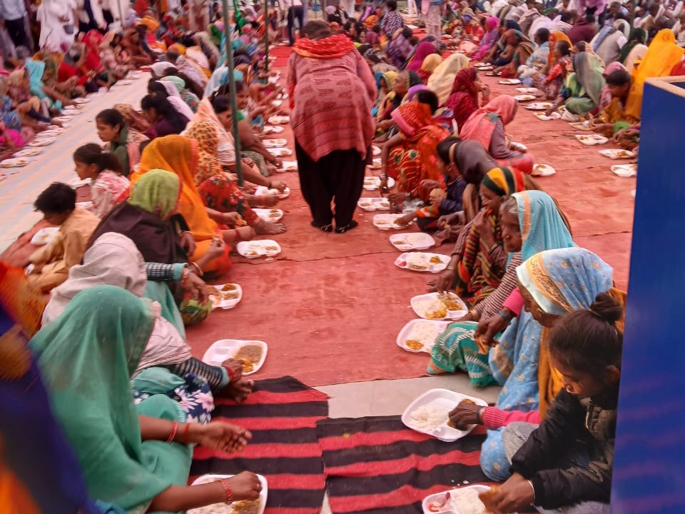 Organizing a feast on the saint's birthday at Madhoganj Ashram