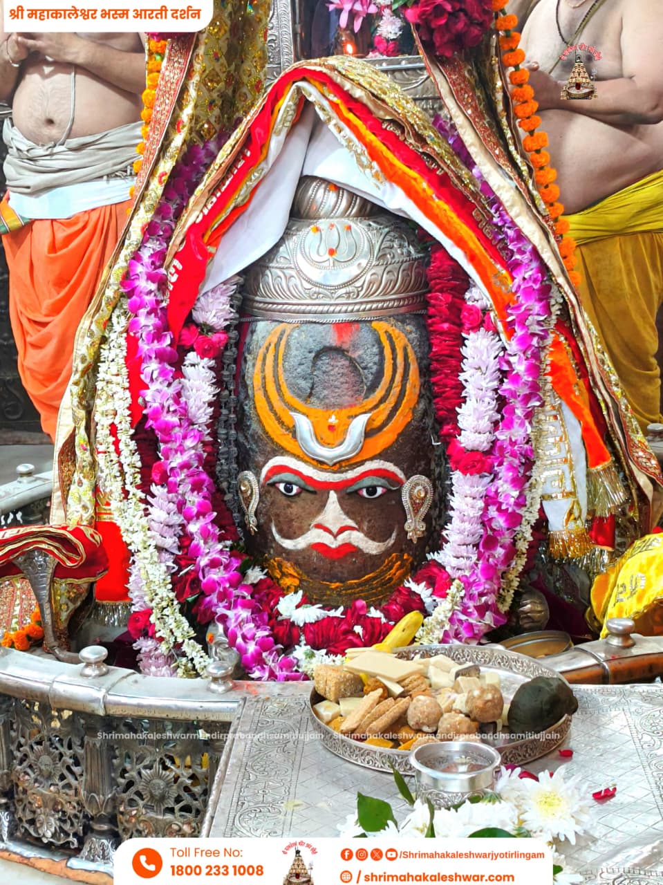 The divine form of the three-eyed Lord Mahakal is adorned by offering ...