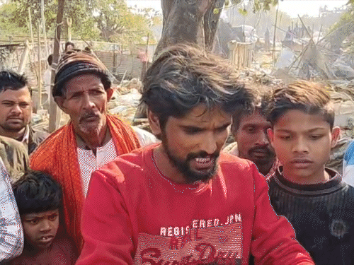 Angry over bulldozer action, man cuts his hair on camera