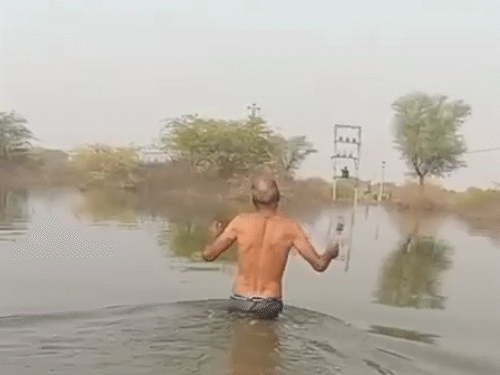 Plumbing workers forced to wade 3 feet deep in water: Walking a ...