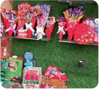 Chocolates, Belgian bars, Kunafa, Godiva in serving dishes along with ...