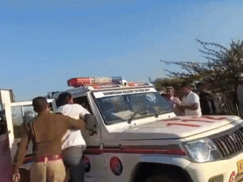 Woman narrowly escapes police jeep on busy highway