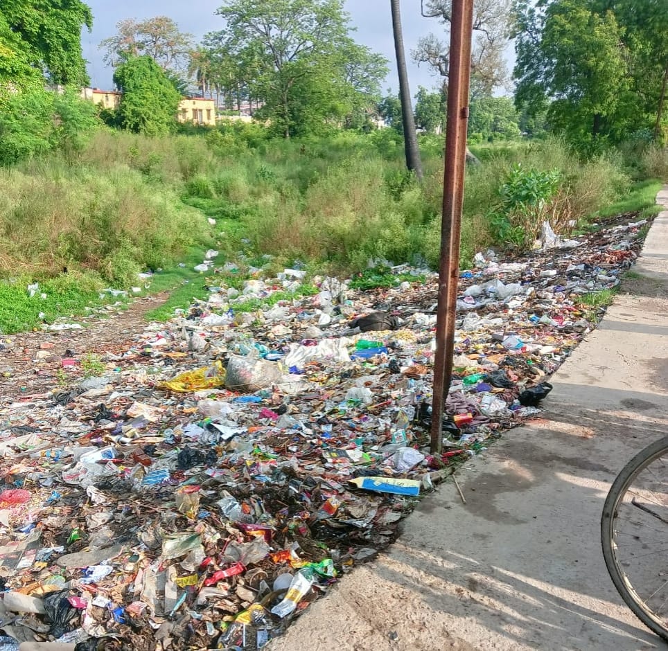 There is a pile of garbage on the side of the road leading to Hasanpur ...