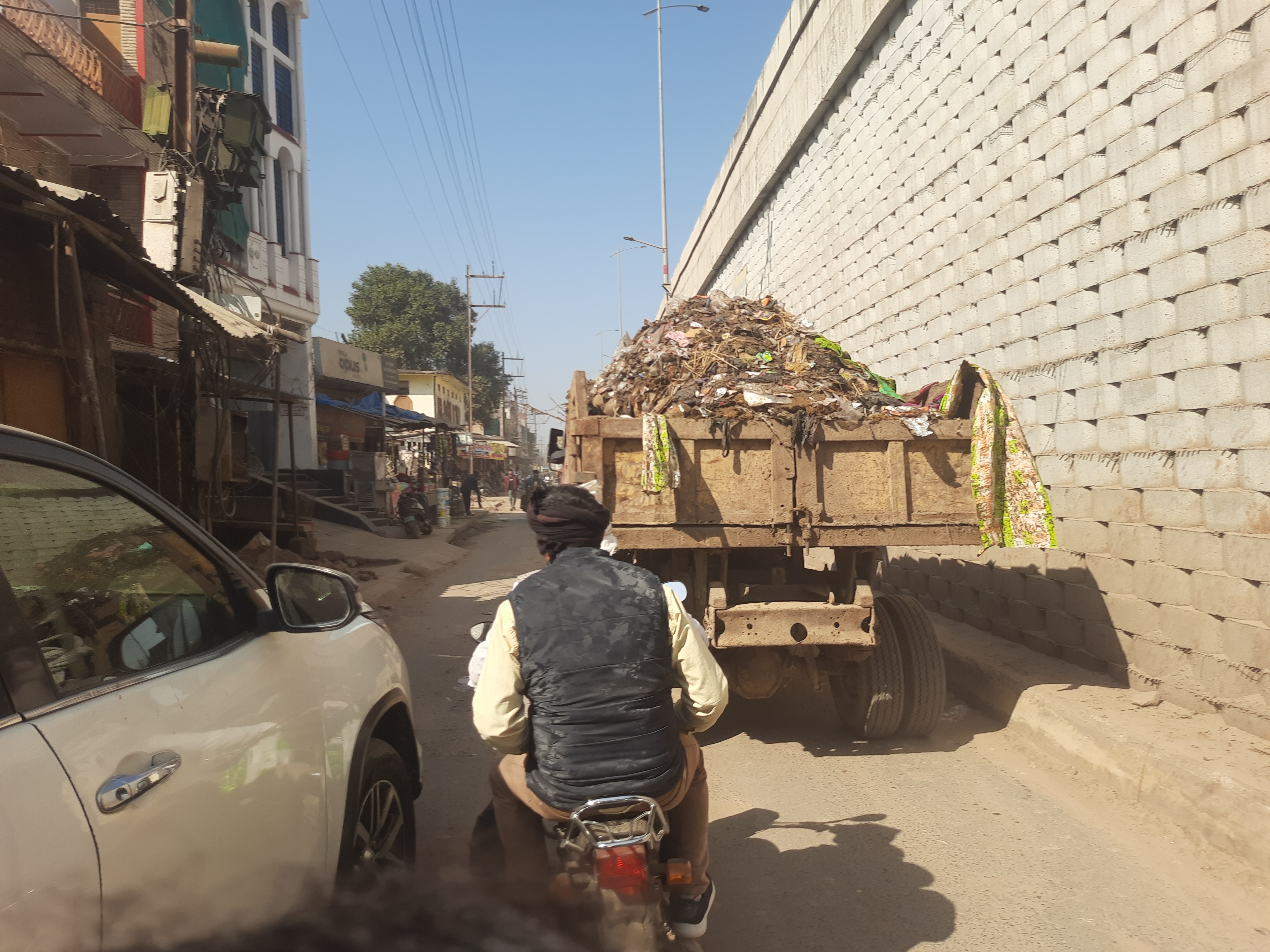 Garbage being taken to the dumping ground in open dumpers