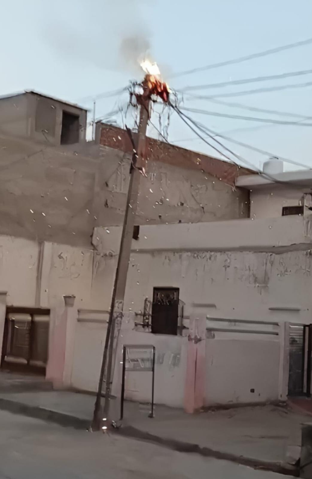 Sparking caused the pole to burn and the wire broke and fell on the bus ...