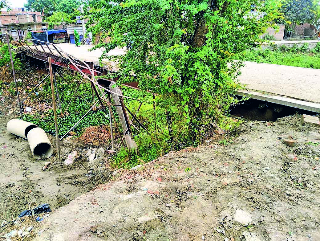 Potholes on the bridge, broken railings, construction not started even ...