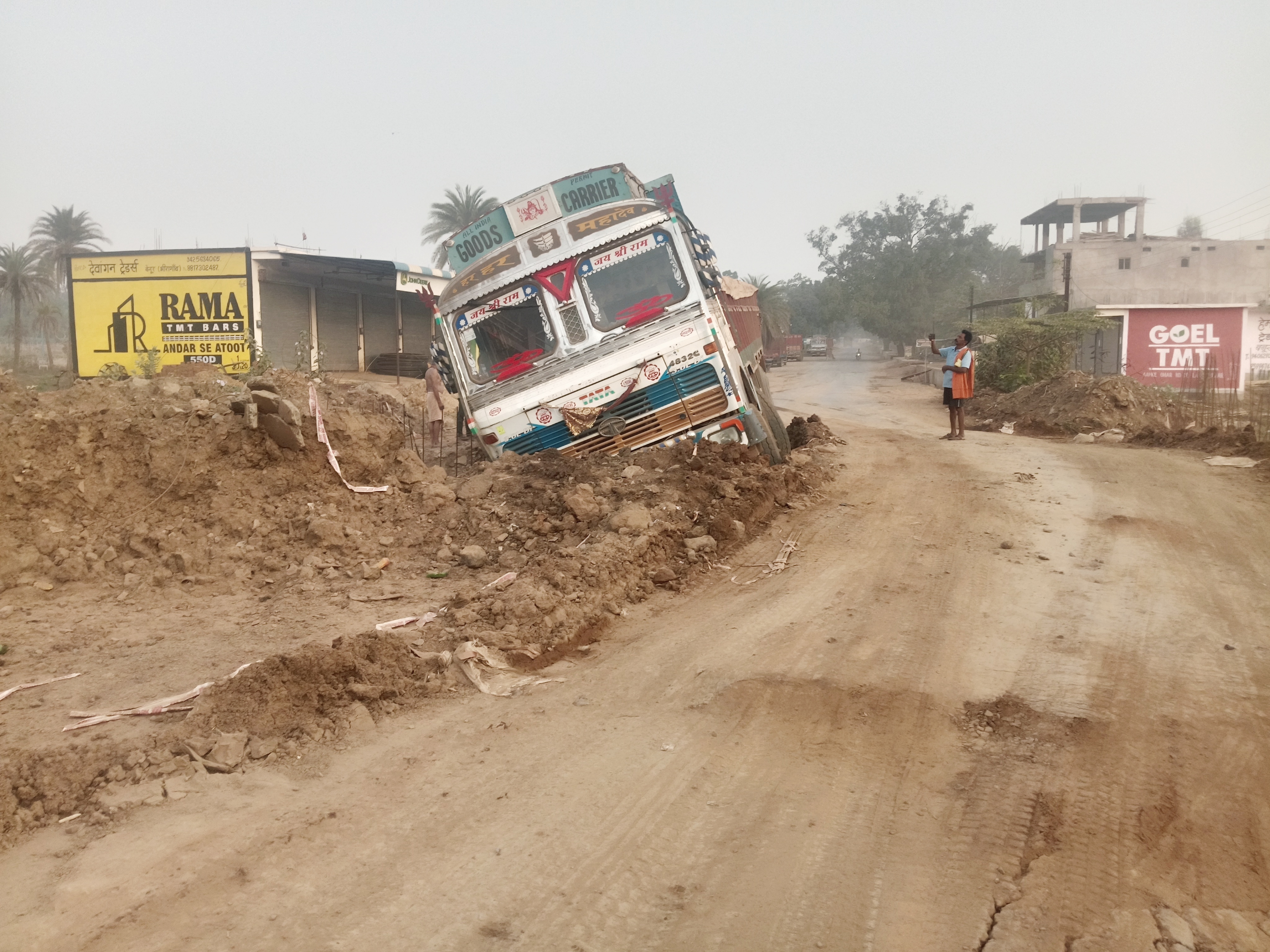 Overloaded truck rams into under-construction culvert, driver narrowly ...