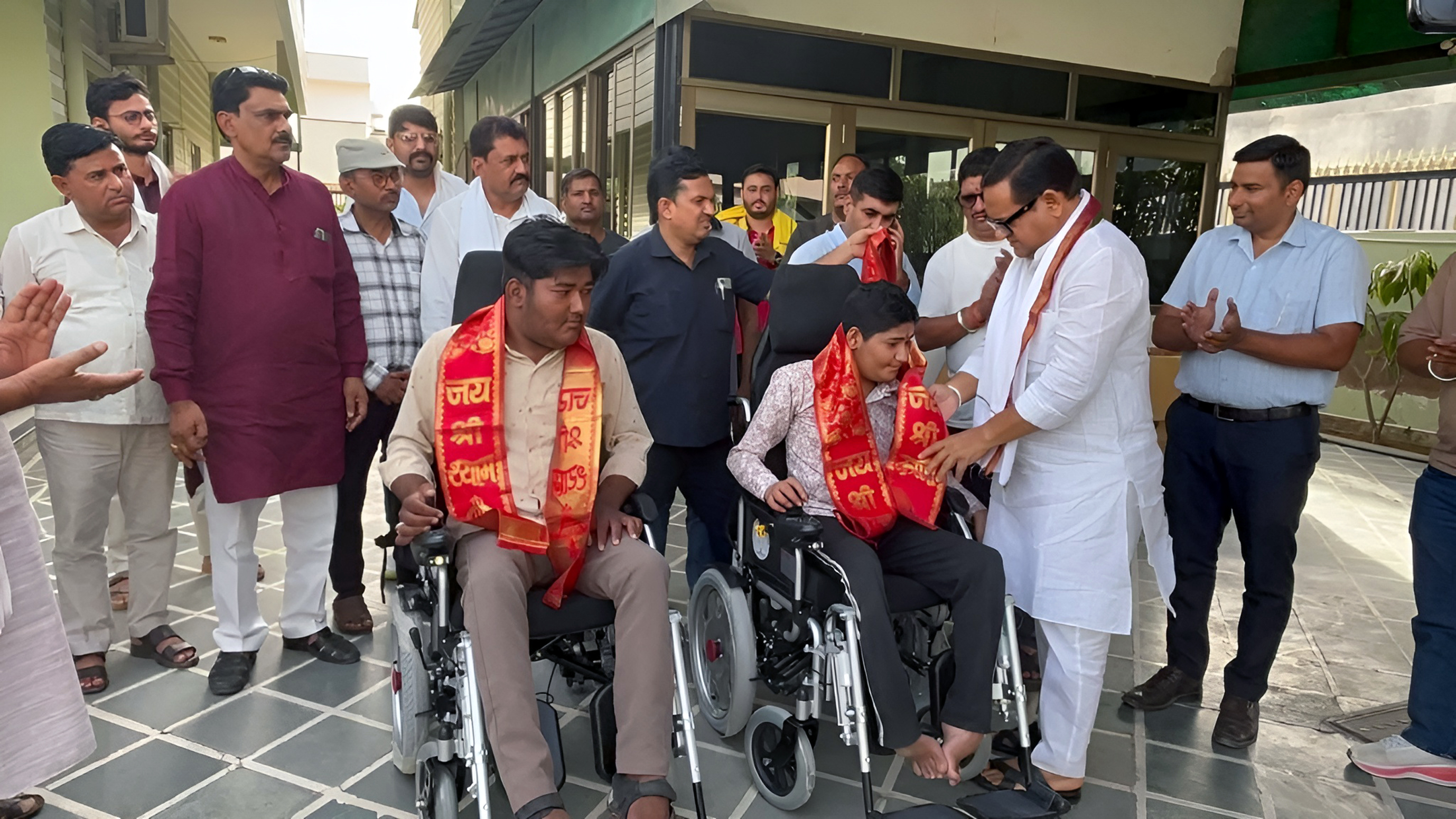 Two disabled people received electric tricycles
