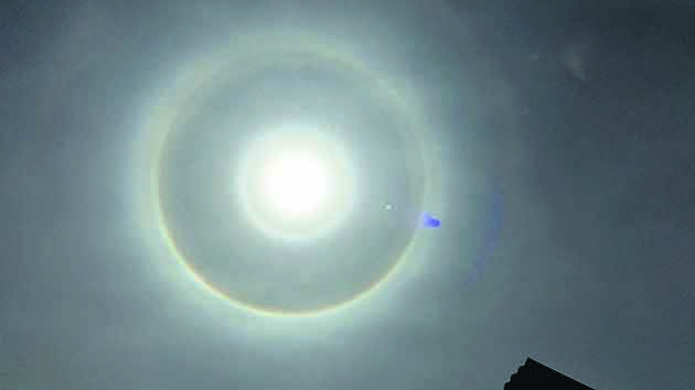 Rainbow circle around the sun after a storm