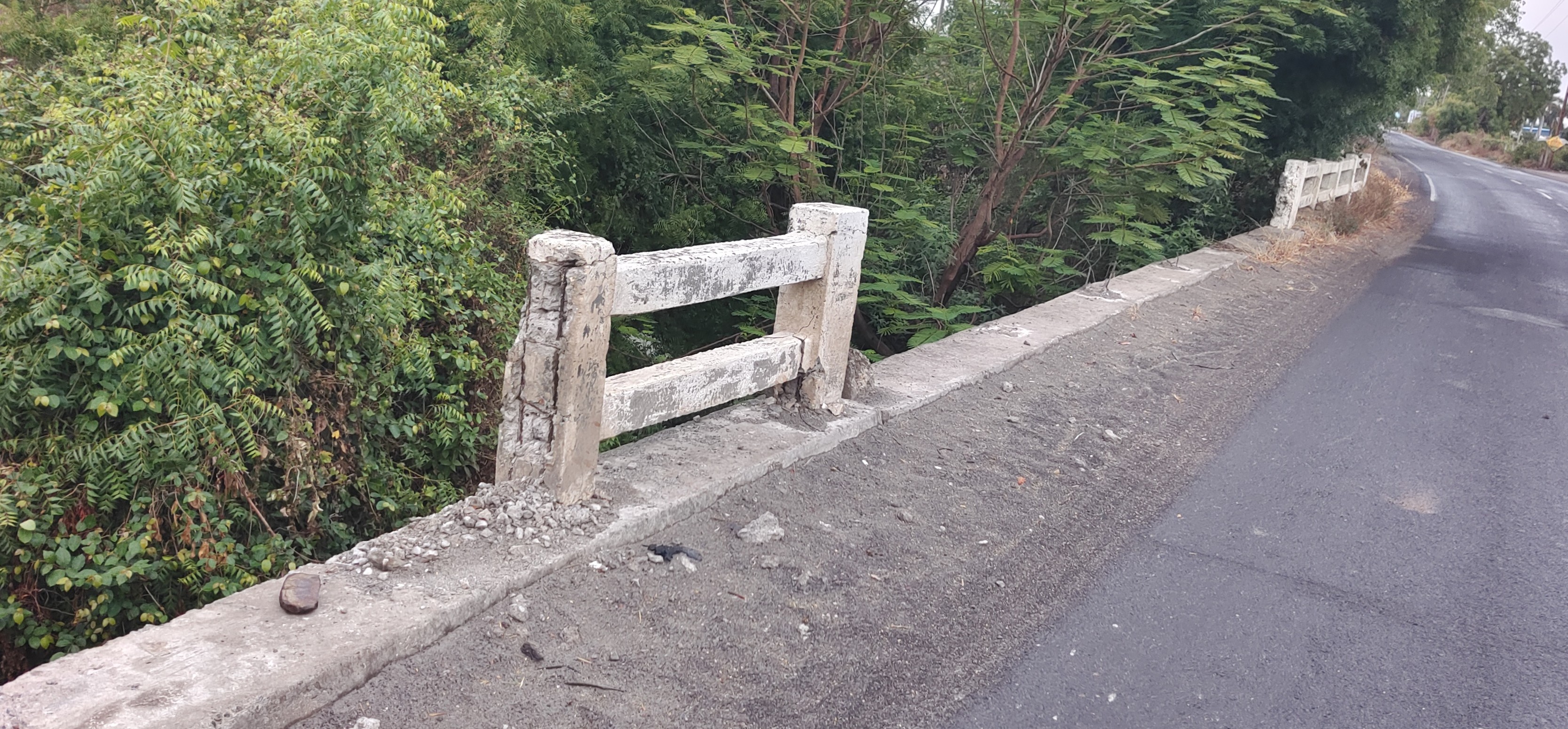 The broken railing of the old bridge on Bediya Road is inviting accidents.