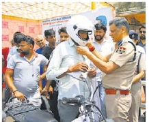 Helmets were given to those riding without helmets and the message of ...