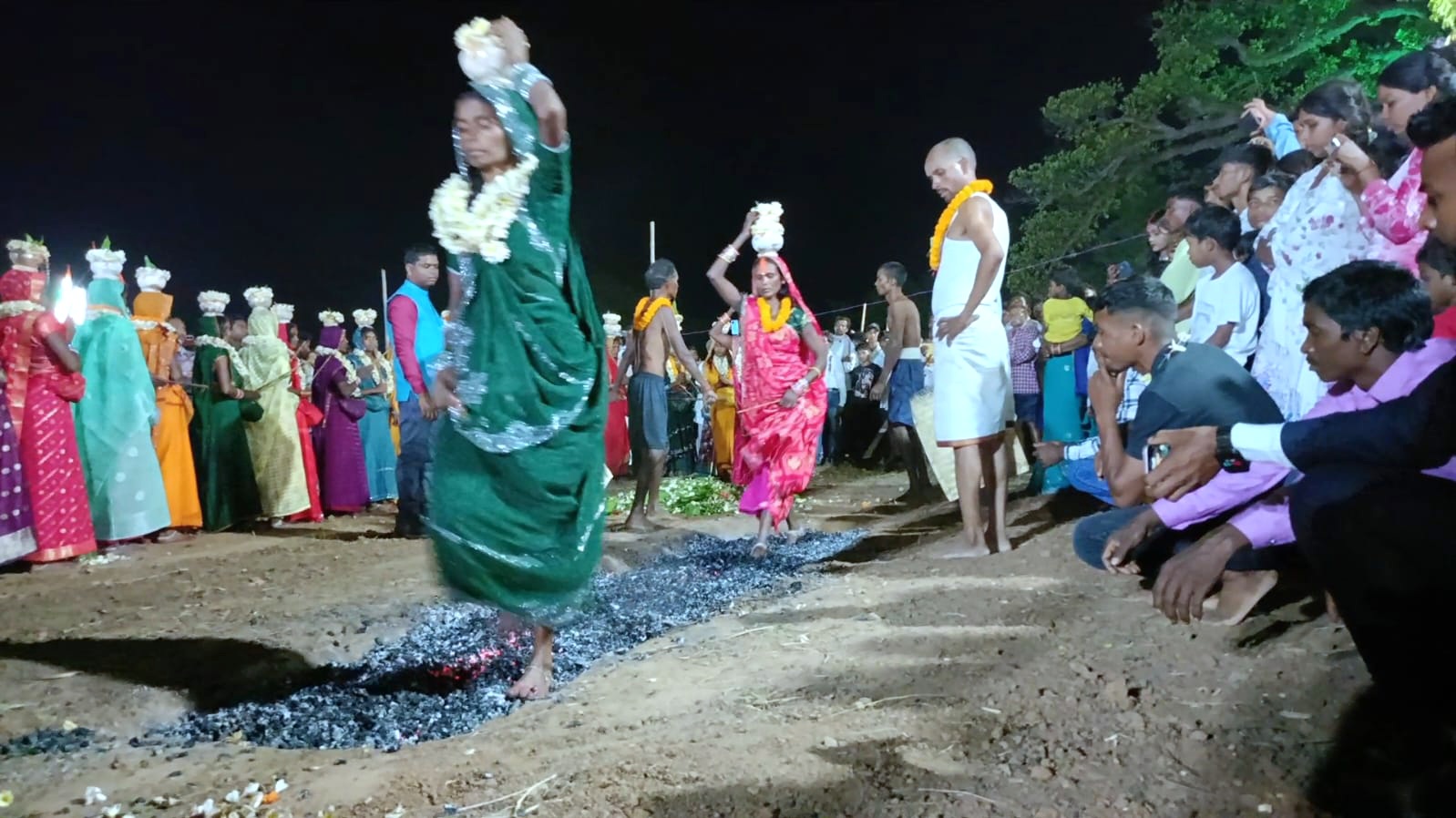 Shiva devotees demonstrated their faith by walking on burning embers ...